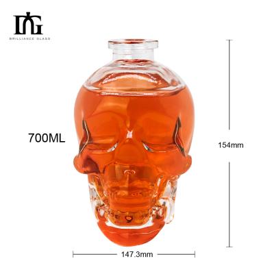 China Custom Glass Skull Bottle with Cork Cap and Glass Material for sale
