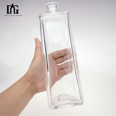 China Transparent Square Glass 500ml 750ml Whiskey Bottle with Cork and Engraving for sale