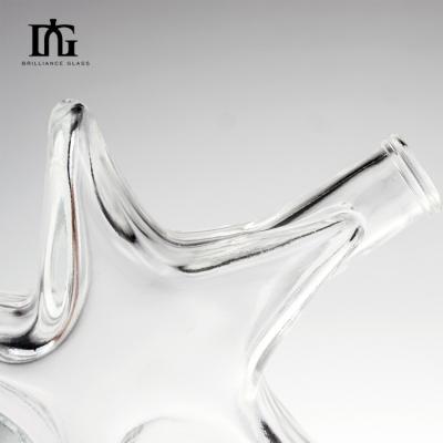 Cina Bottiglie di vetro a forma di stella personalizzate per acqua minerale 250ml/500ml/700ml/750ml Capacità in vendita