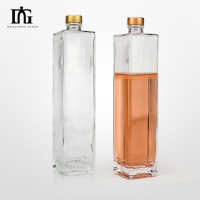 Cina Materiale di base Bottiglia di vetro con tappo a sughero e vite 700 ml Bottiglia di whisky vuota chiara in vendita