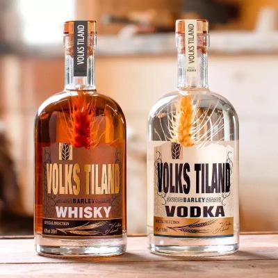Cina 500 ml bottiglia rotonda vuota per vodka whisky gin tequila brandy rum base materiale vetro in vendita