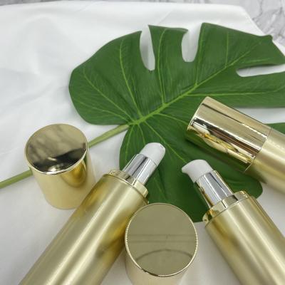 Cina timbratura calda acrilica della pompa di 100ml 120ml della bottiglia dell'oro di plastica vuoto cosmetico della lozione in vendita