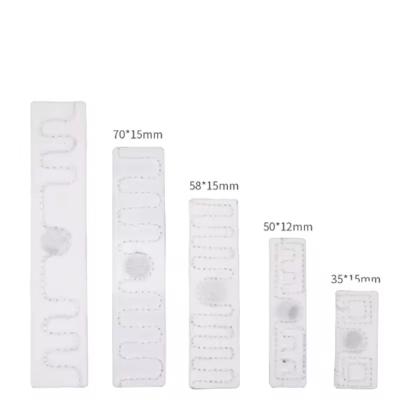 China Washable Heat Seal RFID Laundry Tag UHF UC ODE 8 Chip Over 200 Washing Times for sale