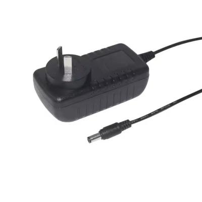 Cina Collegatore AU Pin Dc a 2 AU Pin DC Conductor di rame puro Adaptatore di alimentazione ABS Materiale isolante Input 12V 1A/2A in vendita