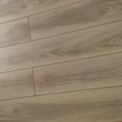 China Three Strips HDF AC3 AC4 12mm ceramic parquet laminated floor for sale