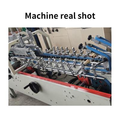 China Doos vouw- en kleefmachine met 380V Spanning Doos ontvouwd Grootte breedte 120mm-500mm Te koop