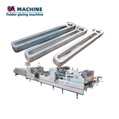 China 1.0 Acessórios de máquinas de colagem automática de caixa dobrável para colagem de caixa e suporte de montagem à venda