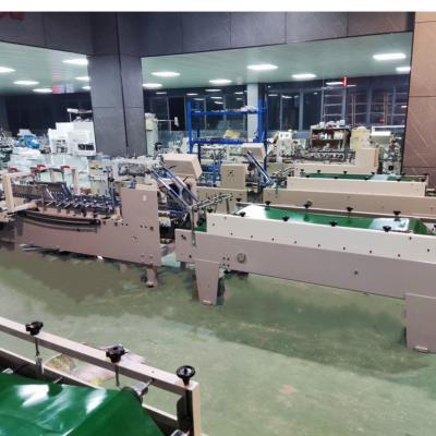 Cina Materiale di carta Mini scatola automatica pieghevole Macchina di incollaggio Scatola dispiegata Dimensione 70mm-400mm in vendita