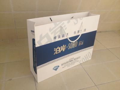 China Flowery Kraft Paper Customized Paper Bags With Ribbon Handle for sale