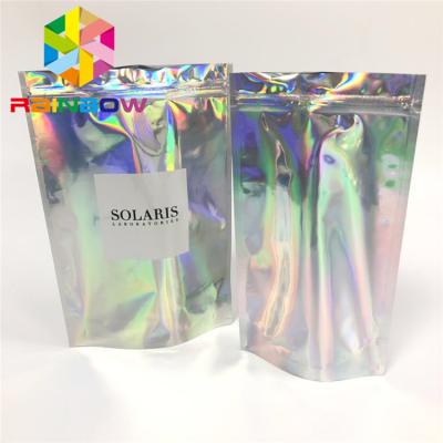 China Heat Seal Surface Plastic Pouches Packaging Hologram Effect Bags With Window for sale