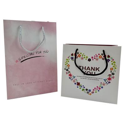 China High Quality Recyclable Customize Design Fancy String Handle Shopping Paper Bag for sale