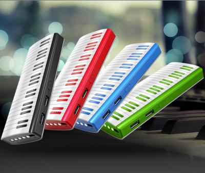 China elegant plastic piano power banks with led light 2 usb ports for sale