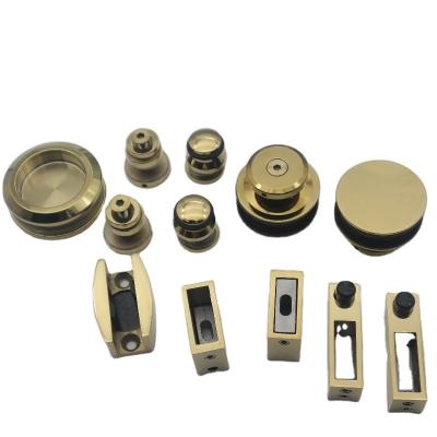 Китай Система раздвижных дверей без рамы SS304 с польскими золотыми роликами и стилем дизайна без рамы продается