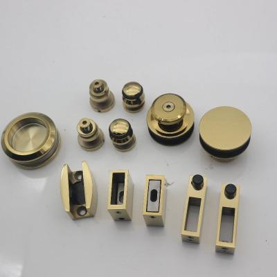 Китай Система раздвижных дверей без рамы SS304 с польскими золотыми роликами и стилем дизайна без рамы продается