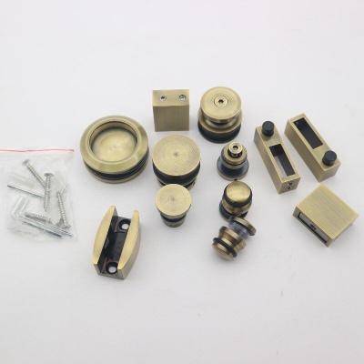 Китай Система раздвижных дверей без рамы SS304 с польскими золотыми роликами и стилем дизайна без рамы продается