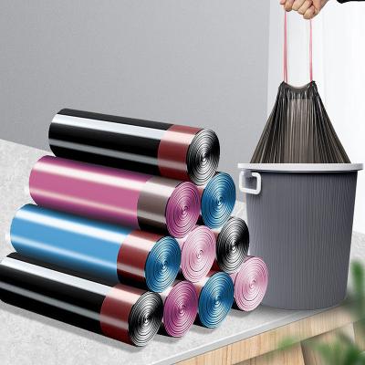 China Saco de lixo portátil de corda de tração para uso doméstico, de design colorido, para fácil manejo de resíduos à venda