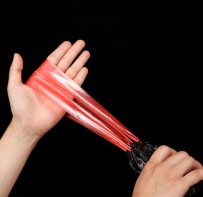 China Saco de lixo portátil de corda de tração para uso doméstico, de design colorido, para fácil manejo de resíduos à venda
