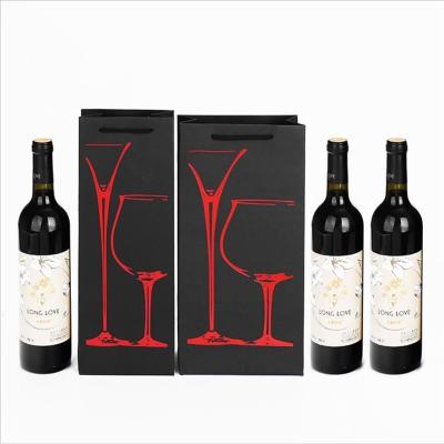 China Matte Black Kraft Paper Red Wine Gift Bags With Flexi Loop Handle for sale