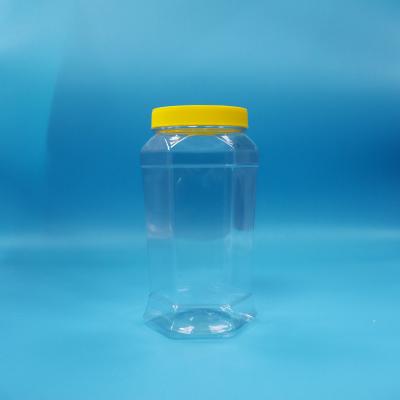 China Food Grade Cookies Candy Hexagonal Shaped Clear PET Food Jar Yellow Screw Cap for sale
