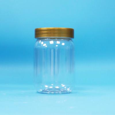 China PET Food Grade Clear Round Cylinder Lollipop Honey Biscuit Plastic Jar Screw Brown Lid for sale