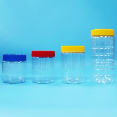 China Variety Round Transparent Peanut Butter PET Plastic Jars Screw Flat Lids Food Grade for sale