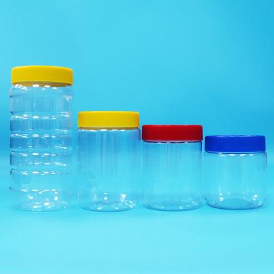 China Round PET Transparent Chocolate Sauce Pistachio Butter Plastic Jars Screw Lids for sale