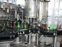 China XGF Series Multi-Head Volumetric Beer Bottling Machine with PLC Control 1000-8000 Bottles/Hour Capacity for sale