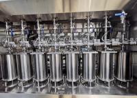 China Programmable Linear Type Gravity Feed  Alcohol Bottle Filling Machine for sale