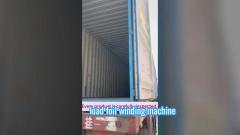 Loading foil winding machine into a container