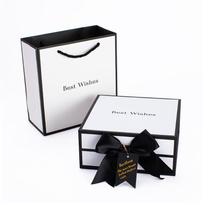 China Christmas Box Paper Boxes And Paper Bags Large Custom Logo Bag Paper Packaging With Bow for sale