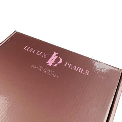 China Logotipo personalizado Caja de papel ondulado brillante Caja de embalaje Caja de regalo plegable Cajas de regalo en venta