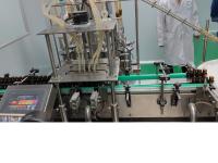 China Automatic 4 Heads Filling And Capping Machine For Fluid Material Processing for sale