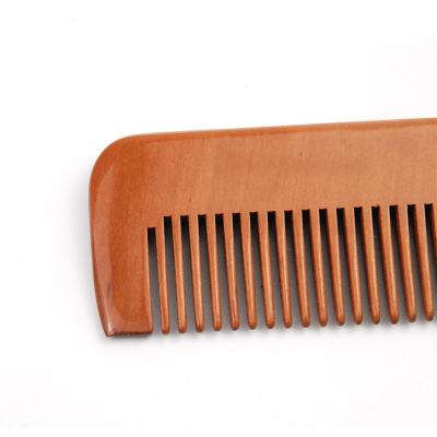 Cina Il pettine di legno fatto a mano di massaggio di mogano vecchio ha scolpito l'anti elettricità statica di perdita di capelli anti in vendita