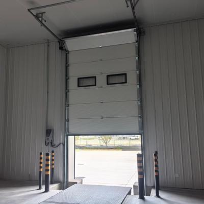 China Insulated-Panel Industrial Sectional Overhead Door For Regional Distribution Center Operations for sale