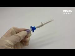 needleless iv bag spike with filter and lipid/alcohol resistant valve port