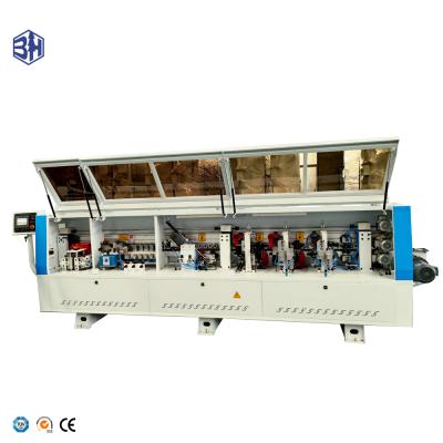 China Automatic Edge Banding Machine integrating glue application edge pressing and trimming units for complete edge finishing for sale