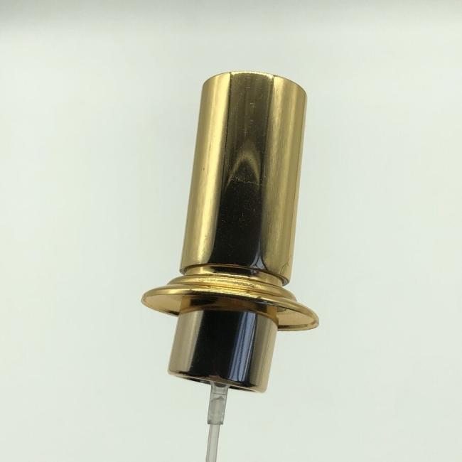 Premium perfume bottle with golden pump in elegant setting