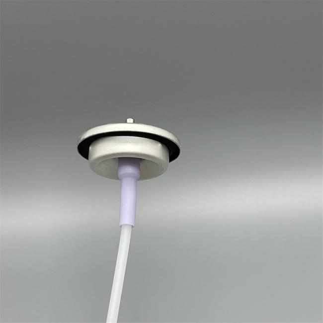 Installation view of Precision Metered Dose Aerosol Valve on container