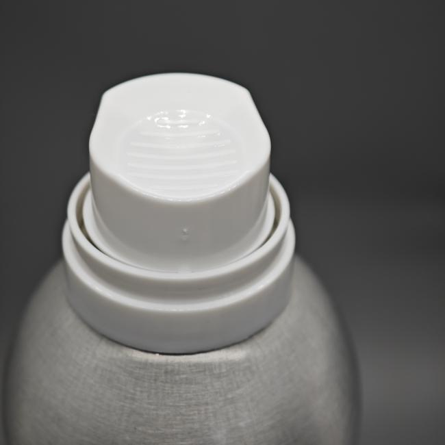 Detailed view of shaving foam valve components disassembled