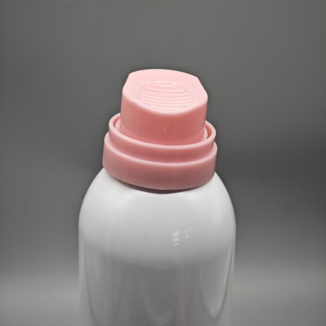 Top view of aerosol actuator for shaving foam showing dispensing nozzle