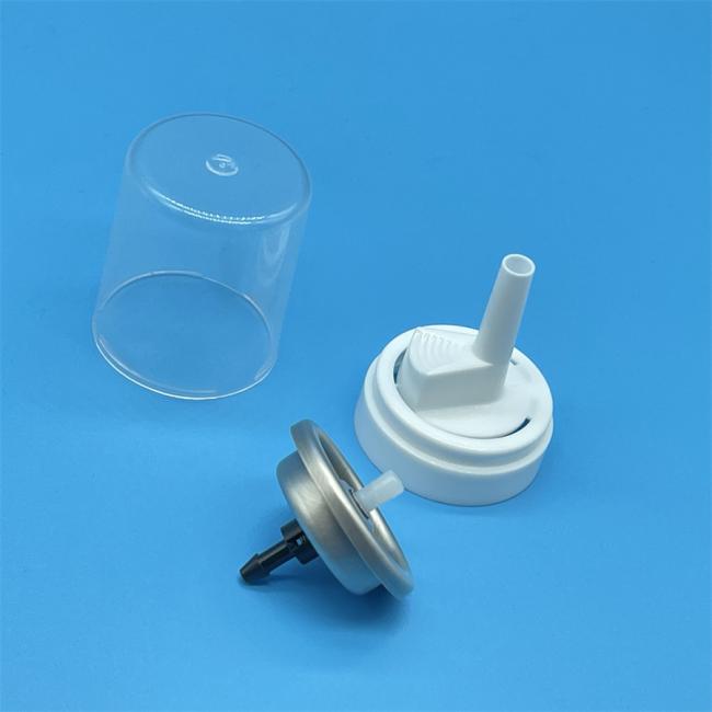 Close-up view of inverted aluminum valve for hair mousse cans