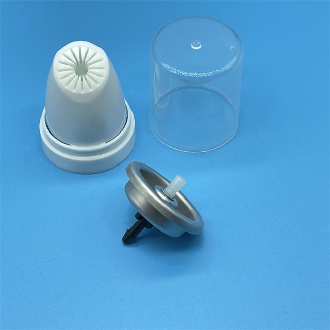 Components of inverted aluminum valve showing valve, actuator and cap