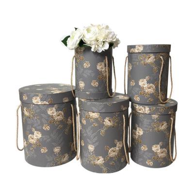 China High Quality Hot Sale Friendly Packaging Box Round Paper Flower Box With Handle for sale