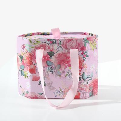 China Custom Fascinating Hexagonal Shape Paper Box Gift Packaging With Handle for sale
