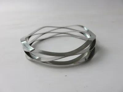 China 50CrVA Steel Wave Spring with Fine Punching Process for Compression Load Applications for sale