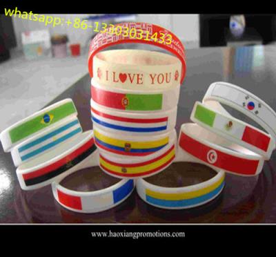 China Custom embossed/imprinted/printed logo Silicone Wristband / rubber bracelet with flag for sale