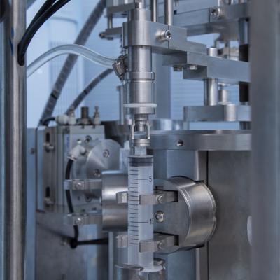 China Automatic Syringe Filling Plugging Machine 80ml Veterinary Anesthesia Sterile Plastic for sale