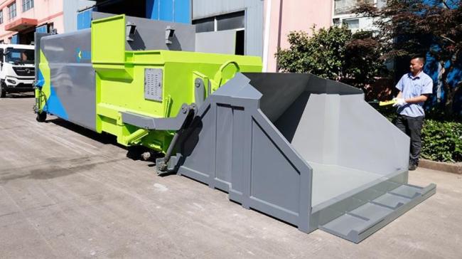 Mobile waste compactor side view