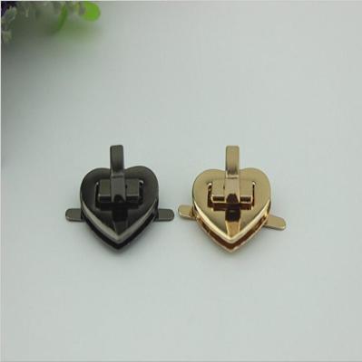 China Fashionable novelty gunmetal color heart shape bag accessories metal twist lock for handbag for sale