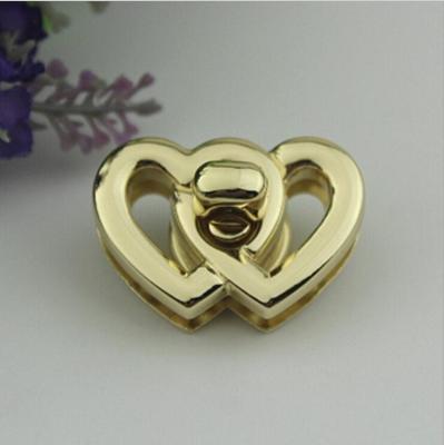 China Design love-heart shape zinc alloy gold metal twist locks for purse for sale